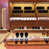 China Natural Solid Wood Perfume Display Cabinet with Illuminated Wall Display and Multi Drawer Storage for sale