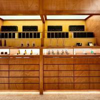 China Natural Solid Wood Perfume Display Cabinet with Illuminated Wall Display and Multi Drawer Storage for sale
