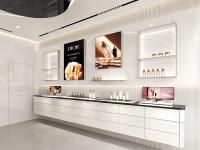 China Custom Luxury Skincare Store Fixture Complete Display Cabinet With Brand Poster Wall & Large Storage Drawers for sale