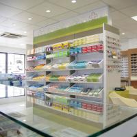 China Modern Medical Store Display Furniture and Custom Pharmacy Wall Cabinets for Retail Drugshop Interior Decoration for sale