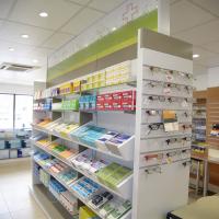 China Modern Medical Store Display Furniture and Custom Pharmacy Wall Cabinets for Retail Drugshop Interior Decoration for sale