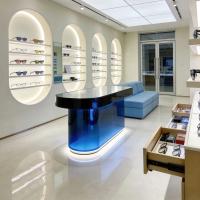 China Eyeglasses Display Rack Glass Showcase Eco-Friendly Heavy Duty Design LED Lighting Customizable for Optical Retail Supermarkets for sale