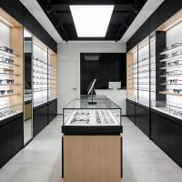 China Contemporary Wooden Optical Display Cabinets Custom Eyewear Showcase with LED Lights for sale