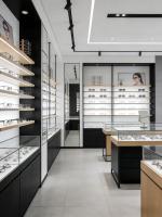 China Contemporary Wooden Optical Display Cabinets Custom Eyewear Showcase with LED Lights for sale