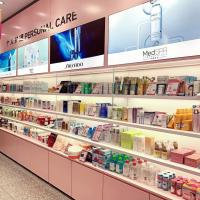 China Custom Display Counter Modern Acrylic Cosmetic Showcase Shelves for Retail Shop Pharmacy Store Beauty Products Display Stand for sale