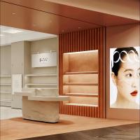China Custom Modern Wooden Cosmetic Display Counter with LED  Beauty Product Showcase  for Contemporary Cosmetic Store Interior Design for sale