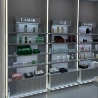 China Custom Retail Makeup Display Stand Cosmetic Shop Counter Display Rack Lipstick Blush Showcase for Stores for sale