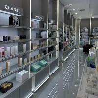 China Custom Retail Makeup Display Stand Cosmetic Shop Counter Display Rack Lipstick Blush Showcase for Stores for sale