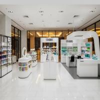 China Custom Cosmetic Display Retail Cabinet Led Makeup Display Racks Cosmetic Island Display Stand for Cosmetic Shops - for sale
