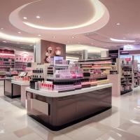 China Premium Pink Custom Makeup Store Showcase - LED-lit Wooden Cosmetic Shelves, Salon Display Cabinet for sale