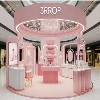 China Custom Pink Makeup Display Booth  LED Cosmetic Showcase Kiosk for Cosmetics Shop Retail for sale