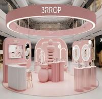 China Custom Pink Makeup Display Booth  LED Cosmetic Showcase Kiosk for Cosmetics Shop Retail for sale