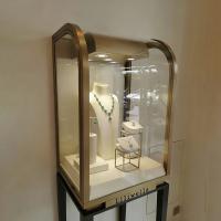 China CustomizedJewelry Display Cabinet Curved Bronze Frame  Jewelry Display Stands For Retail for sale