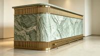 China Freestanding Natural Green Jade Marble Retail Reception Desk with Full Gold Metal Frame for High-End Boutique Stores for sale