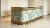 China Freestanding Natural Green Jade Marble Retail Reception Desk with Full Gold Metal Frame for High-End Boutique Stores for sale