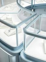 China Pastel Blue Jewelry Counter Display Curved Soft  Jewellery Display Retail for sale