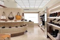 China Full Warm Neutral Minimal Leather Shoe Handbag Store Interior Design for sale