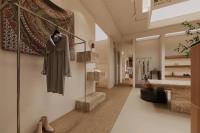 China Warm Cream Neutral Tone Women Clothing Store Interior Design with Modular Detachable Display System and Multi-Zone Functional Layout for sale