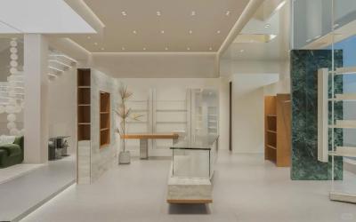 China Warm Neutral Natural Texture Ladies Shoe Shop Design | Minimal Footwear Store Layout for sale