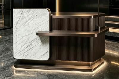 China Luxury Fluted Bronze Reception Counter with Marble Side Panel and Base LED Light for High-End Hotels for sale
