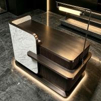 China Luxury Fluted Bronze Reception Counter with Marble Side Panel and Base LED Light for High-End Hotels for sale