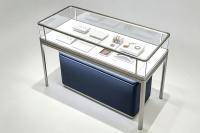 China Light Luxury Rounded Edge Glass Jewelry Display Counter With Storage Cabinet 1200*550*950mm for sale