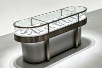 China Custom Oval Tempered Glass Jewelry Island Display Counter with Stainless Steel Frame and LED Lighting for Boutique Jewelry Shop for sale