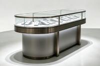 China Custom Oval Tempered Glass Jewelry Island Display Counter with Stainless Steel Frame and LED Lighting for Boutique Jewelry Shop for sale