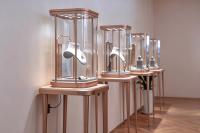 China Custom Rose Gold Tall Pedestal Jewelry Display Cabinet with Ultra Clear Tempered Glass and Top LED Lighting for sale