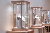 China Custom Rose Gold Tall Pedestal Jewelry Display Cabinet with Ultra Clear Tempered Glass and Top LED Lighting for sale
