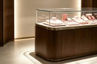 China Walnut Grain Veneer Jewelry Display Counter with Rounded Glass Corners and Built-in LED Lighting for sale