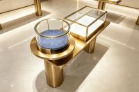 China Modular Jewelry Showcase Table with Brushed Gold Metal Structure and LED Illumination for Luxury Boutiques for sale