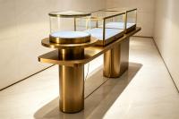 China Modular Jewelry Showcase Table with Brushed Gold Metal Structure and LED Illumination for Luxury Boutiques for sale
