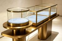 China Modular Jewelry Showcase Table with Brushed Gold Metal Structure and LED Illumination for Luxury Boutiques for sale