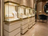 China Tall Wall-Mount Jewelry Display Cabinet with Brushed Gold Frame and Drawer Base for Luxury Jewelry Boutiques for sale