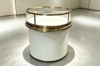 China Round Jewelry Island Showcase with Brushed Gold Frame, 360-Degree Viewing and Integrated LED Lighting for sale
