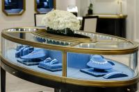 China High-End Oval Jewelry Island Showcase with Curved Tempered-Glass and LED Accent Lighting Featuring Lockable Drawer for sale