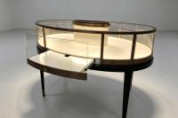 China Oval Jewelry Island Showcase with Bronze-Gold Frame and Raised Central Display Podium for 360-Degree Panoramic Viewing for sale