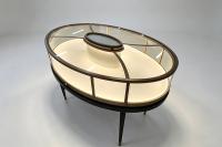 China Oval Jewelry Island Showcase with Bronze-Gold Frame and Raised Central Display Podium for 360-Degree Panoramic Viewing for sale