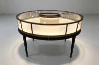 China Oval Jewelry Island Showcase with Bronze-Gold Frame and Raised Central Display Podium for 360-Degree Panoramic Viewing for sale