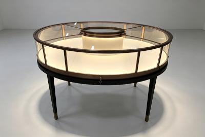 China Oval Jewelry Island Showcase with Bronze-Gold Frame and Raised Central Display Podium for 360-Degree Panoramic Viewing for sale
