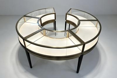 China Luxury Modular C-Shaped Split Jewelry Island Showcase with Brushed Gold Stainless Steel Frame and Full-Surface Warm LED Illumination for sale