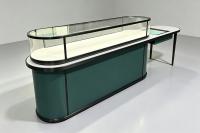 China Luxury Jewelry Showcase with Curved Tempered-Glass Display and Dark-Green Leather Wrapped Base Featuring Integrated Consultation Table for sale