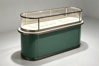 China Luxury Jewelry Showcase with Curved Tempered-Glass Display and Dark-Green Leather Wrapped Base Featuring Integrated Consultation Table for sale
