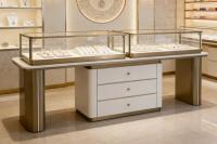 China Luxury Dual Glass Jewelry Showcase Counter with Champagne Gold Metal Frame and LED Illumination for sale