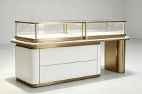 China Modern Jewelry Counter with Brushed Champagne Gold Frame, Offset Dual Glass Showcase, and Lockable Storage Drawers for sale