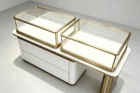 China Modern Jewelry Counter with Brushed Champagne Gold Frame, Offset Dual Glass Showcase, and Lockable Storage Drawers for sale