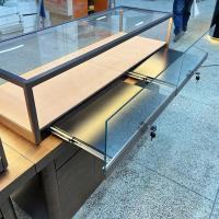 China Modular Dark Wood Grain Jewelry Showcase Counter with Curved Cabinet and Bottom Ambient Light for sale