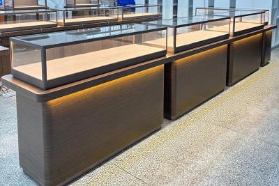 China Modular Dark Wood Grain Jewelry Showcase Counter with Curved Cabinet and Bottom Ambient Light for sale