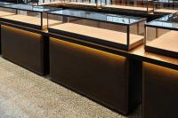 China Modular Dark Wood Grain Jewelry Showcase Counter with Curved Cabinet and Bottom Ambient Light for sale
